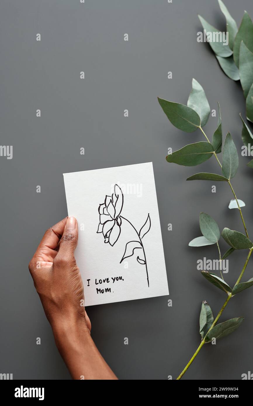Hand of unrecognizable African American woman holding handmade greeting ...