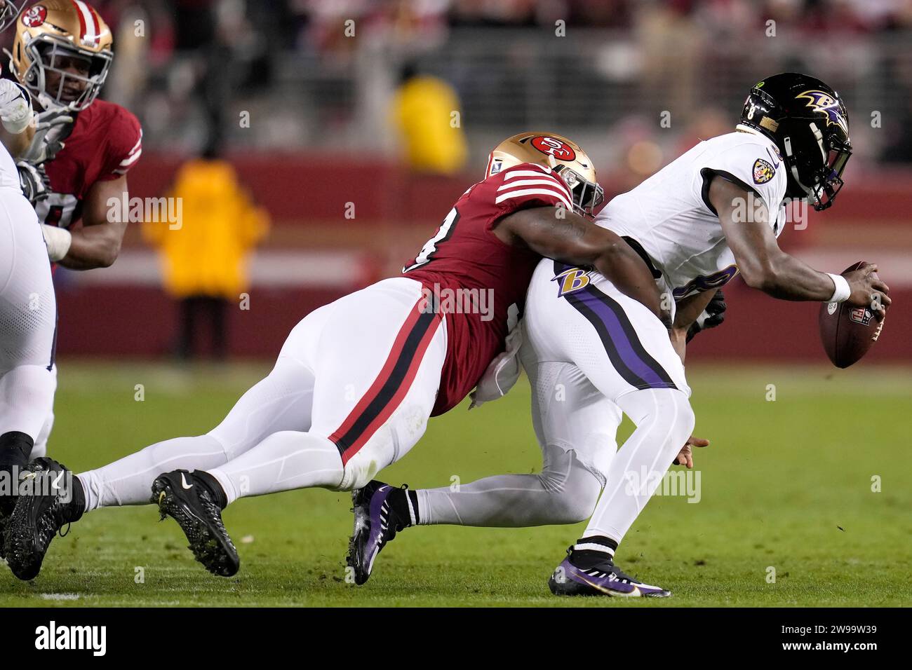 San Francisco 49ers defensive tackle Javon Hargrave, left, sacks ...