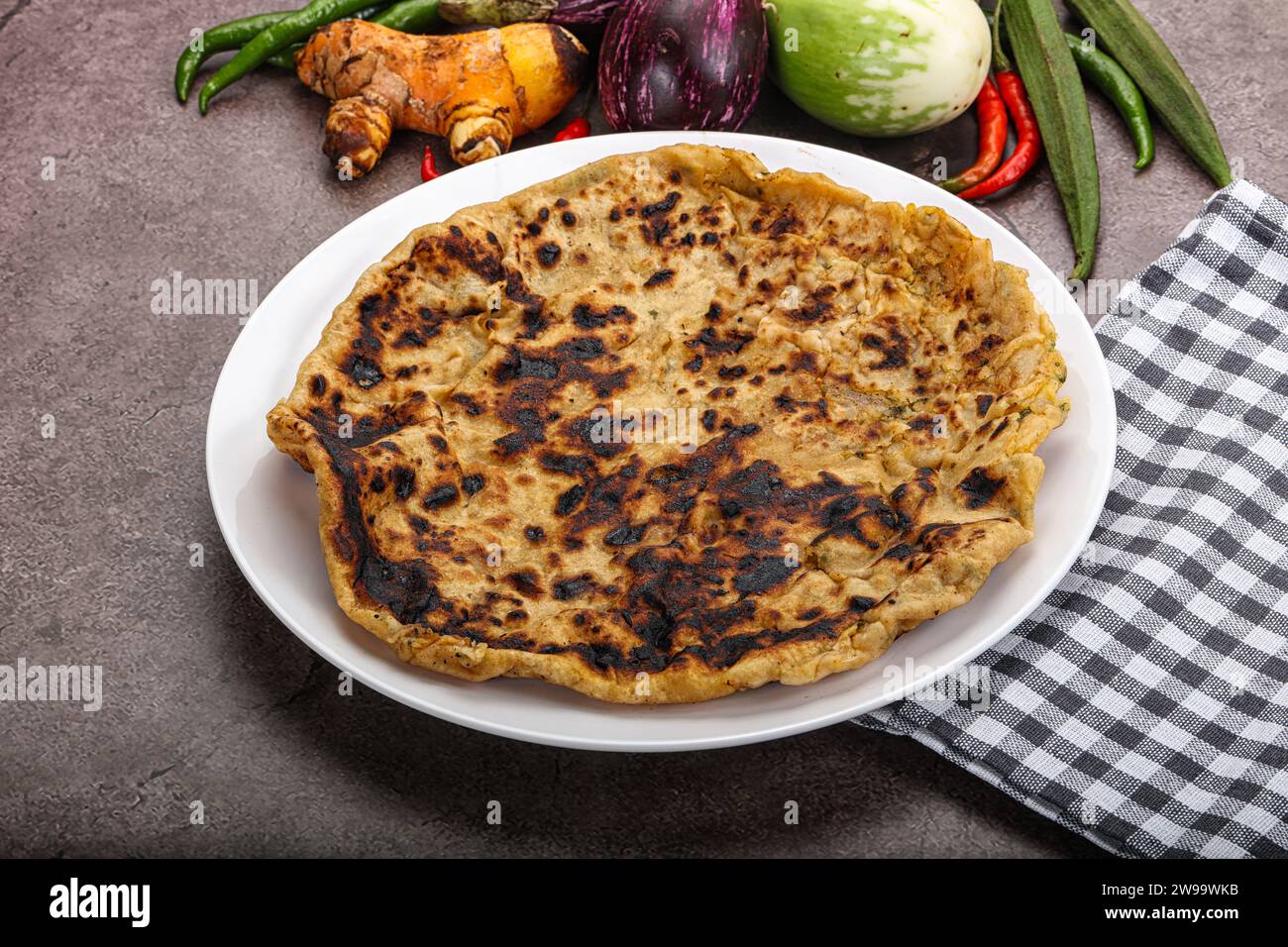 Indian cuisine stuffed Aloo paratha - bread with potato Stock Photo - Alamy