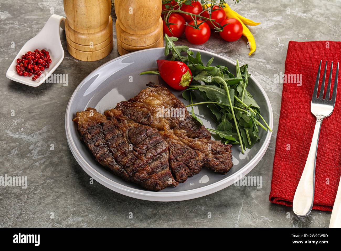 Grilled chuck roll beef steak with arugula Stock Photo - Alamy
