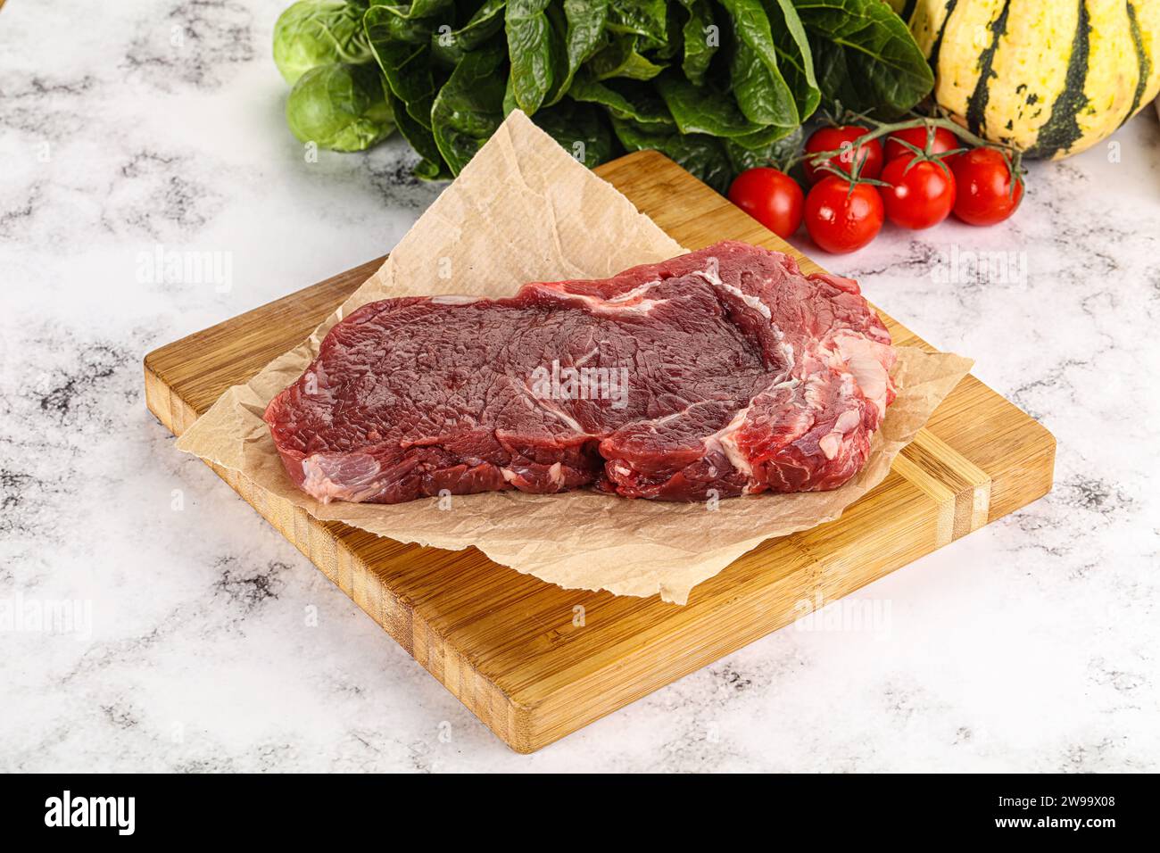 Raw rib eye beef premium steak for grill Stock Photo - Alamy