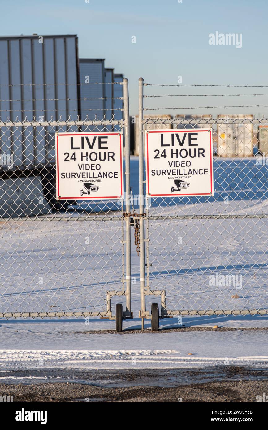 Chained security gates with camera for security Stock Photo - Alamy