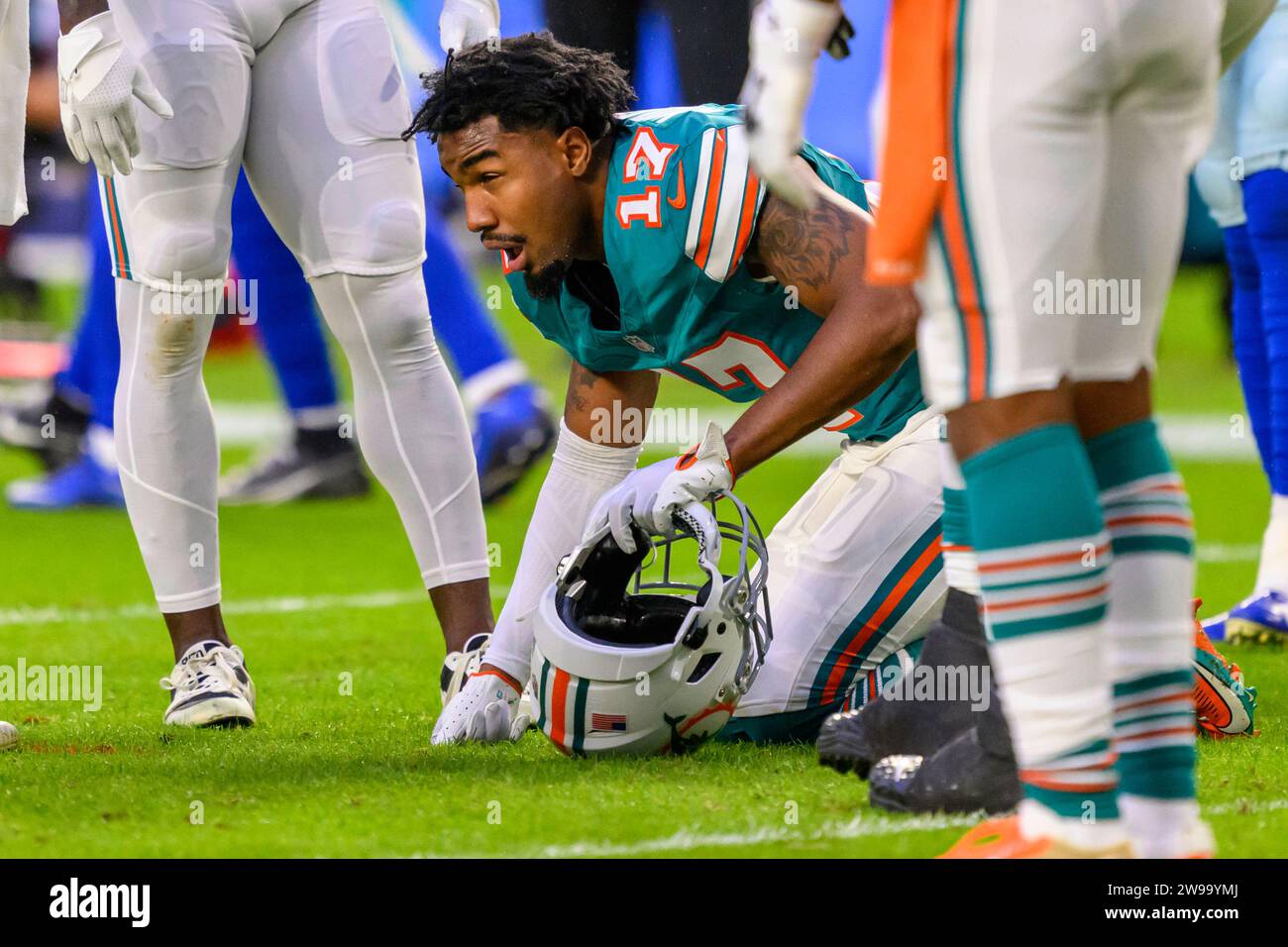 Miami Dolphins wide receiver Jaylen Waddle (17) grimaces in pain as he ...