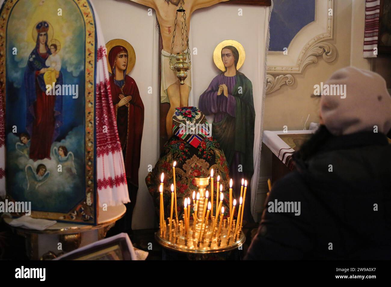 Odessa, Ukraine. 25th Dec, 2023. Woman kisses the Crucifix during the ...