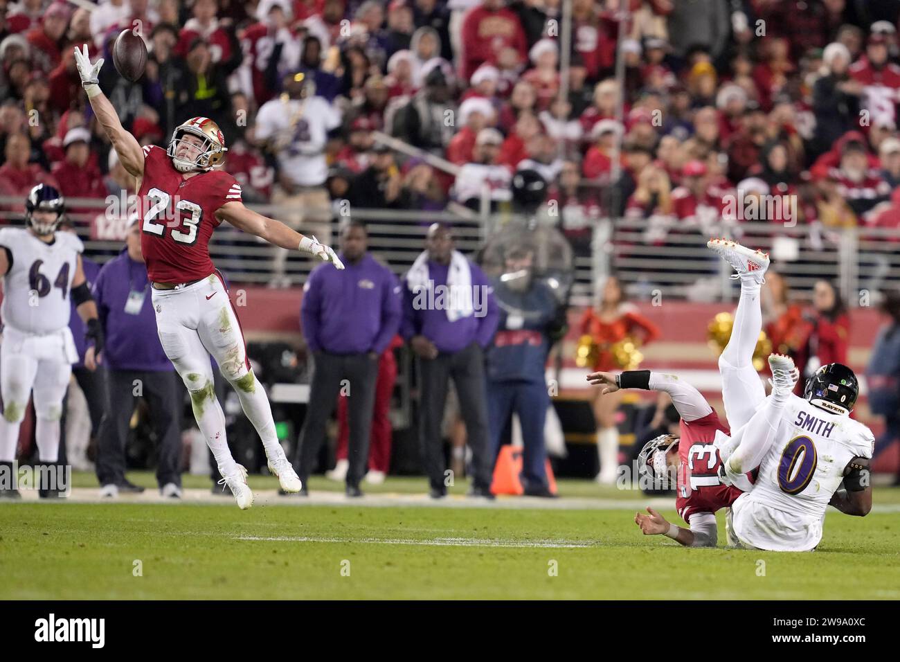 San Francisco 49ers running back Christian McCaffrey (23) reaches to catch the ball as ...