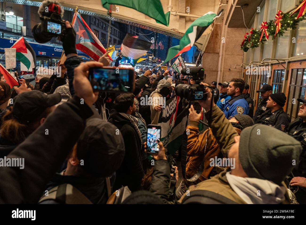 Hundreds of pro-Palestinian protesters rally on Rockefeller plaza and ...