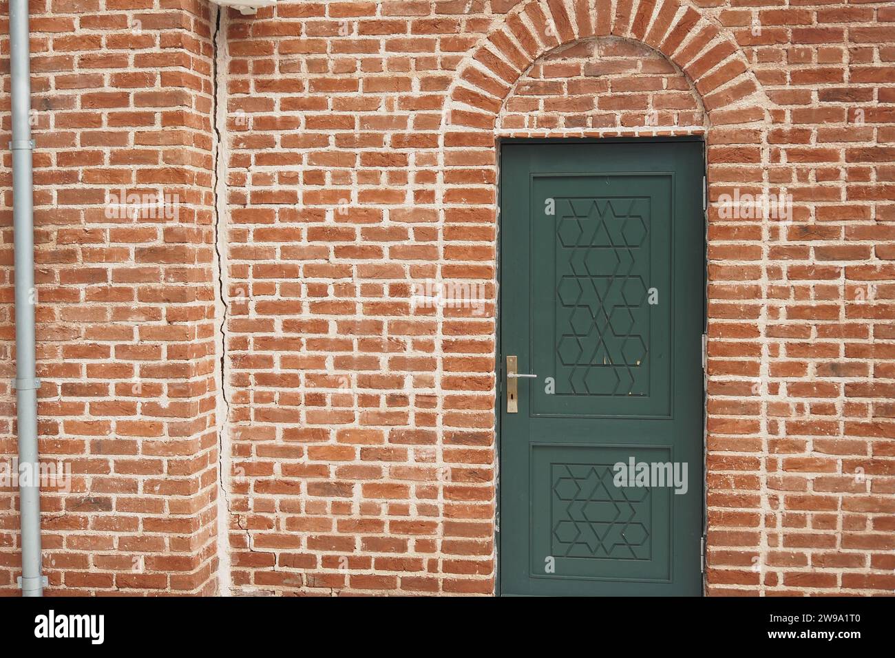 wood door texture background on brick wall Stock Photo - Alamy