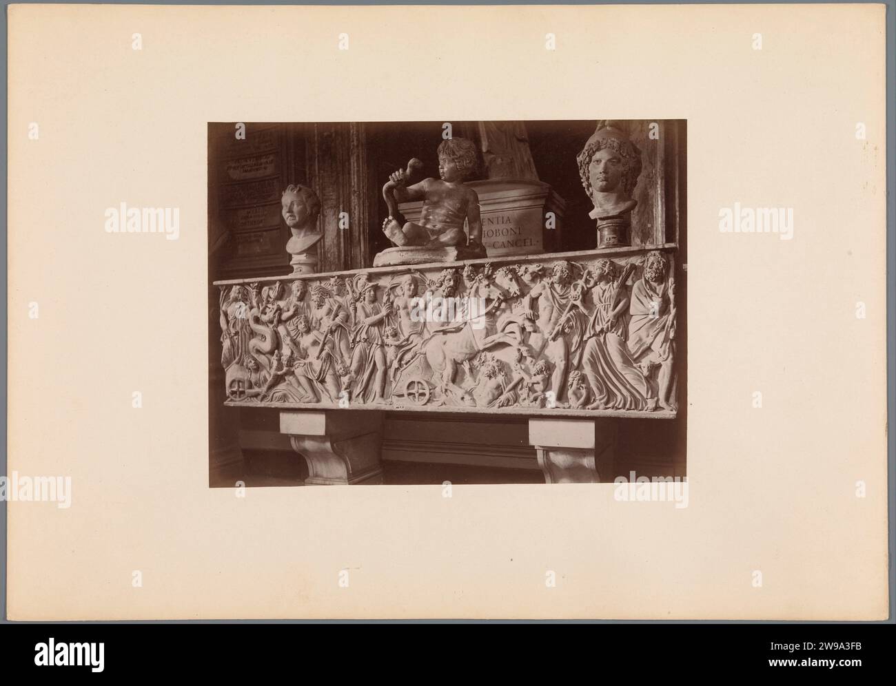 Setup of a relief, two busts and a statue of Herakles with snakes ...