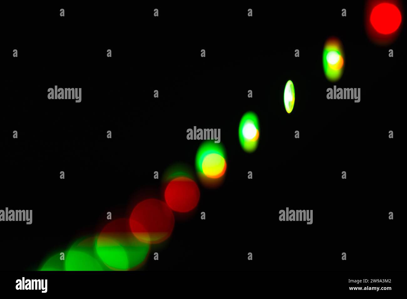 Abstract blurred background with blurred red green LED lights, close up photo with bokeh effect ...