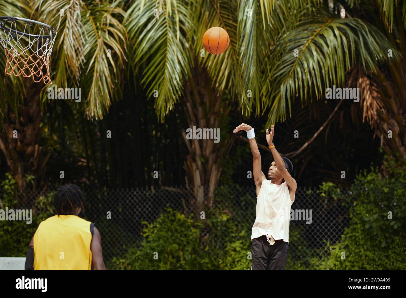 Accurate basketball player throwing ball in basket when playing ...