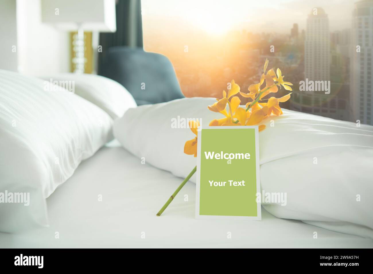 Welcome card placed inside a hotel room bed with Yellow orchid Stock ...