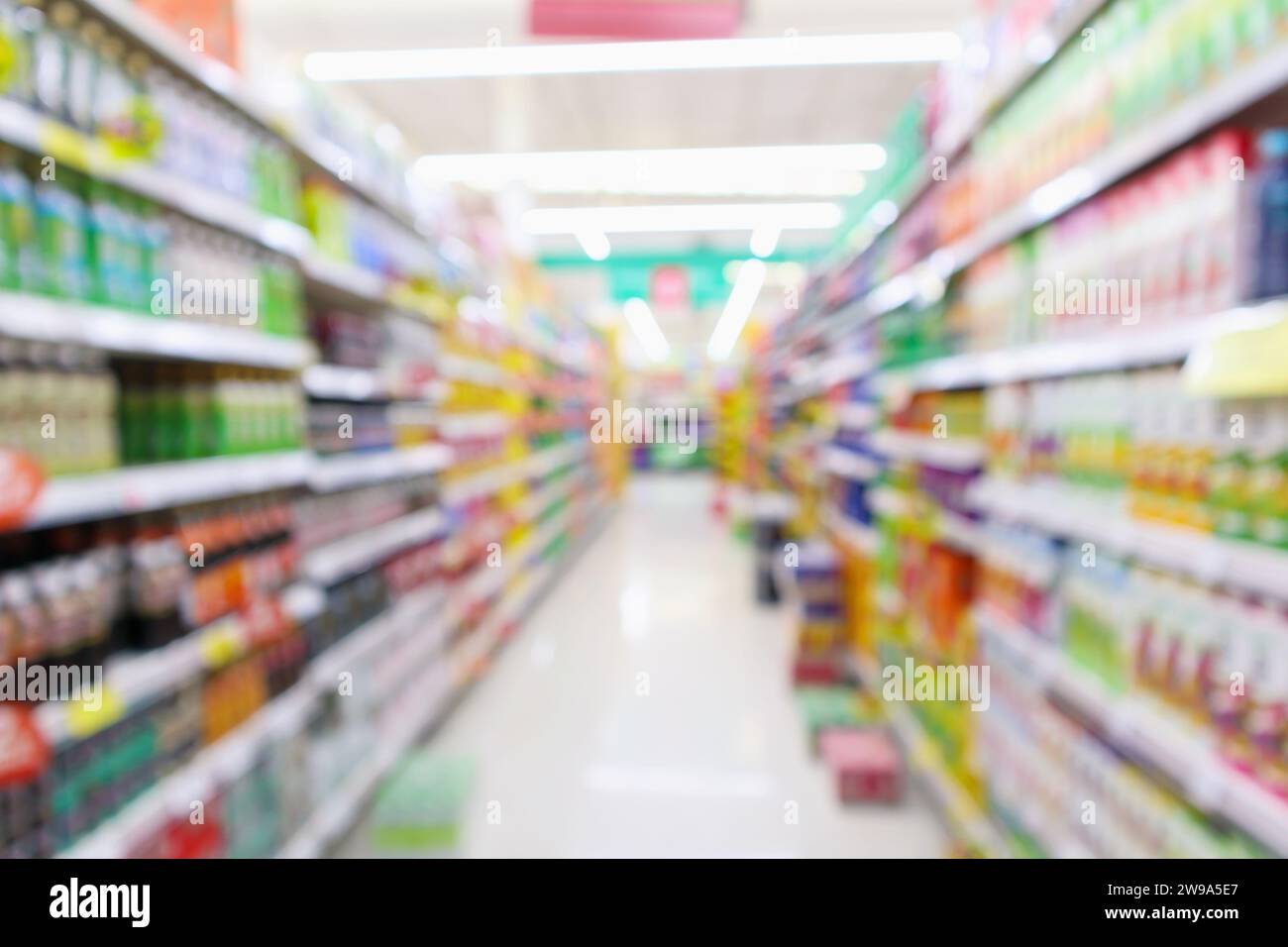 Abstract blur supermarket aisle background Stock Photo - Alamy