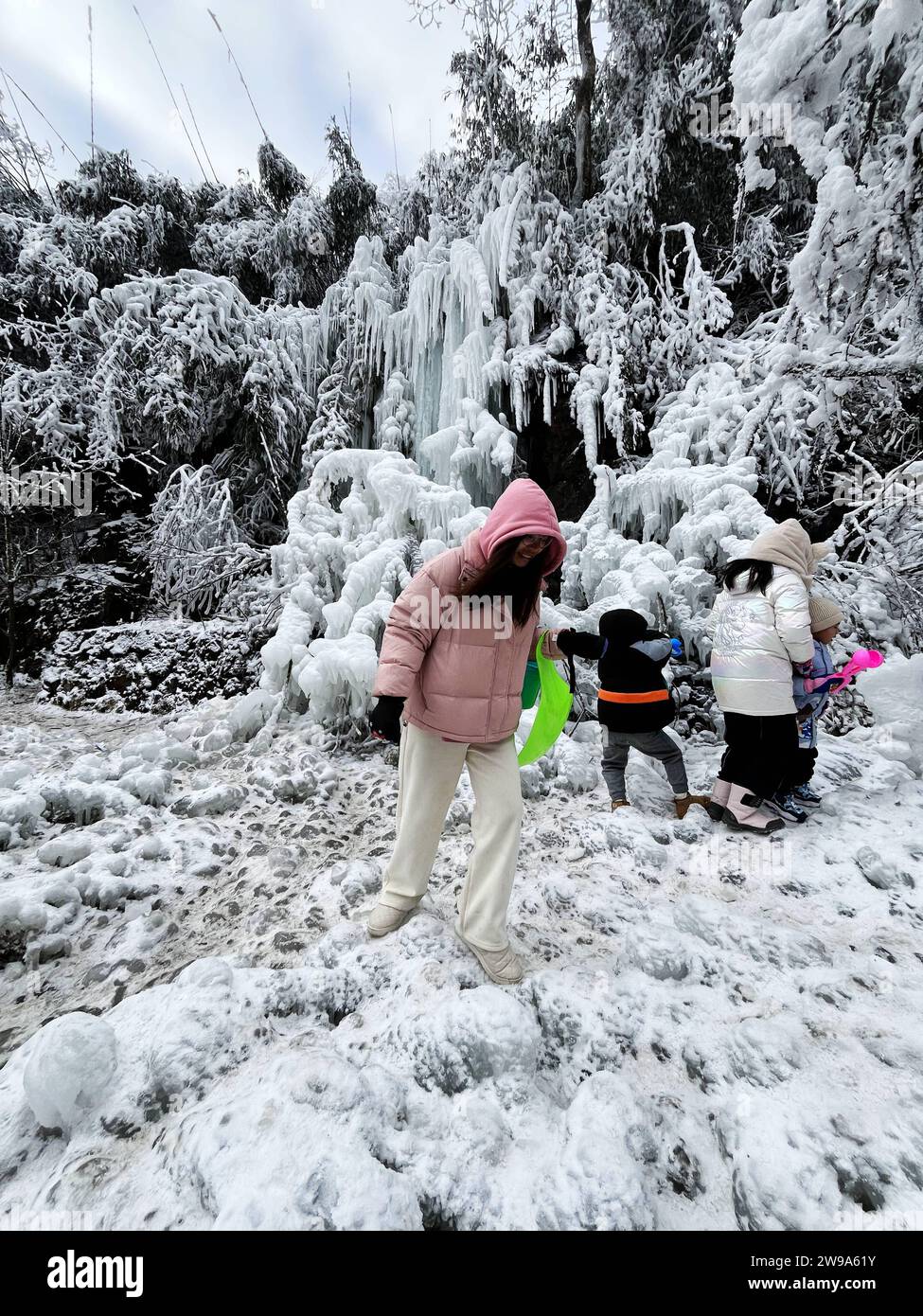 CHONGQING, CHINA - DECEMBER 24, 2023 - Tourists come to enjoy the snow ...