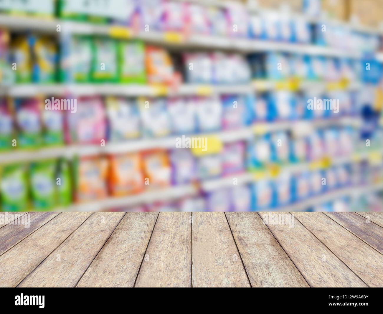 wood table top with detergent shelves in laundry section in supermarket ...