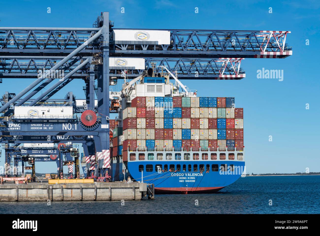 A large fully loaded container vessel moored at Patrick Sydney AutoRail ...