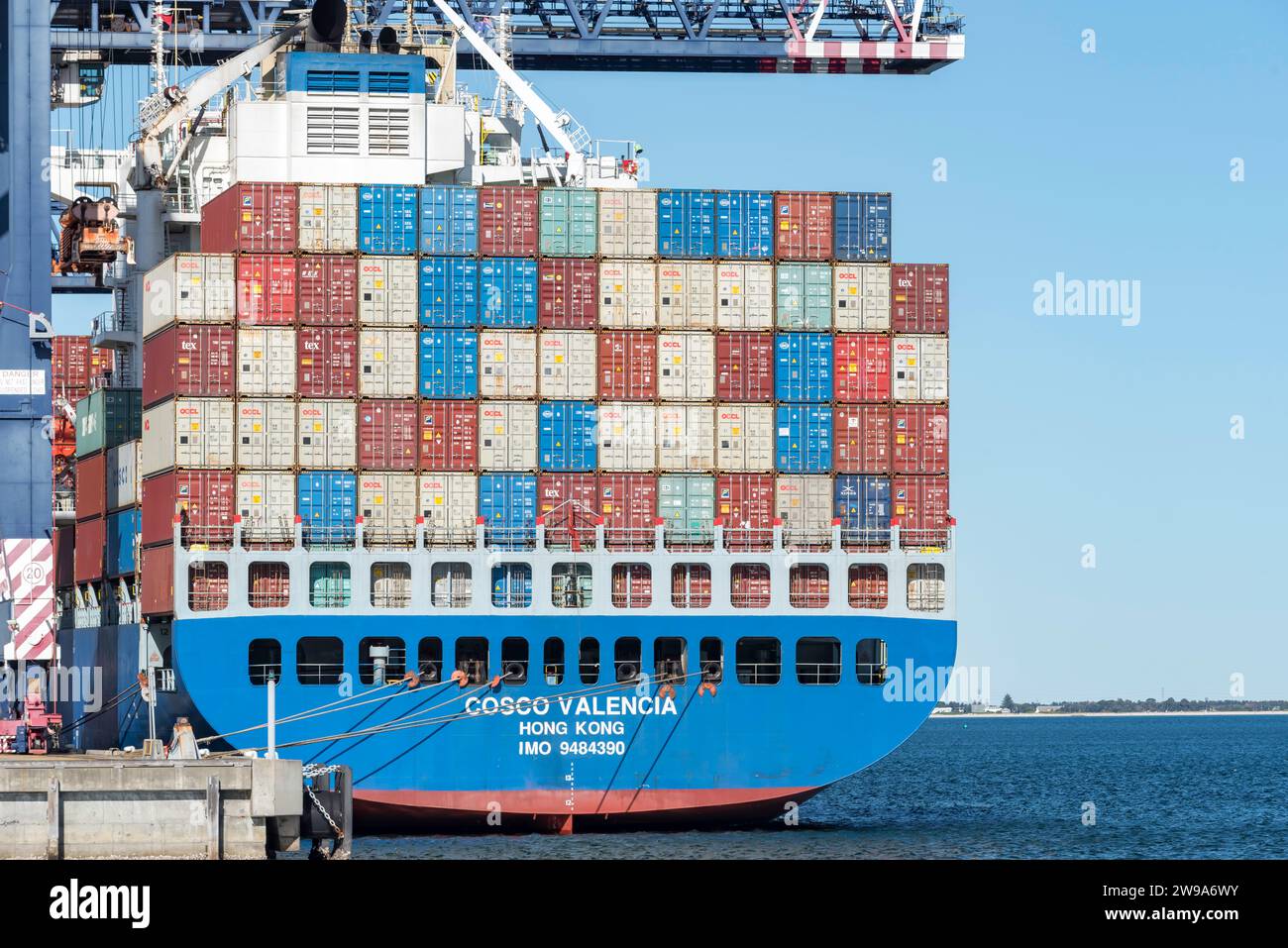 A large fully loaded container vessel moored at Patrick Sydney AutoRail ...