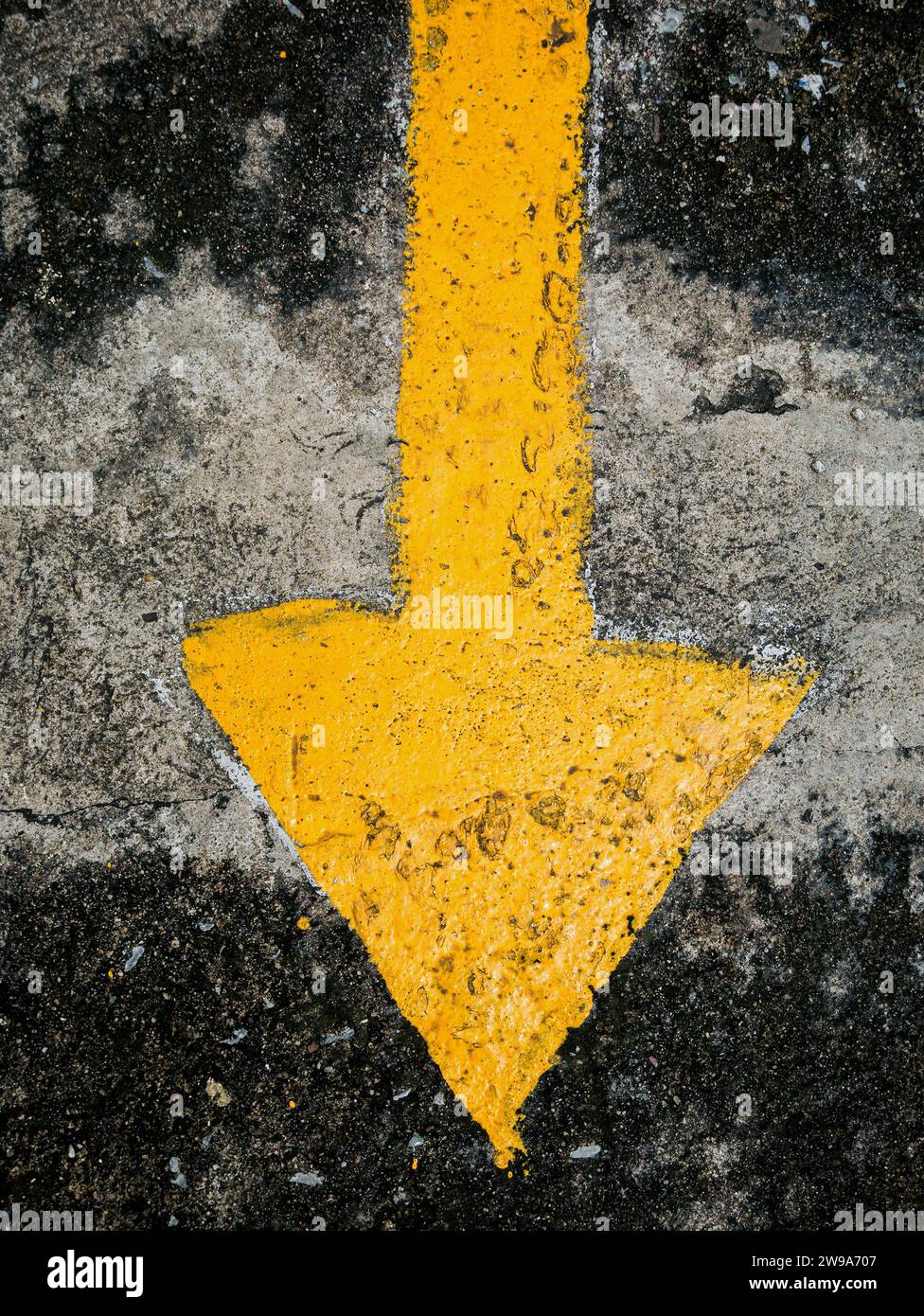 traffic direction arrow on the road Stock Photo - Alamy