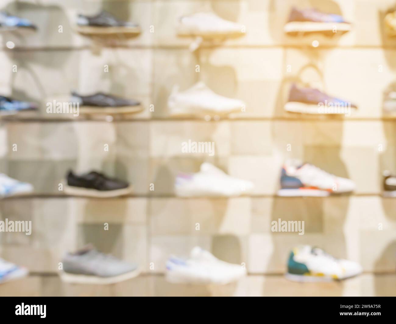 Sport Shoes on shelves in the shoes store blur for background Stock ...