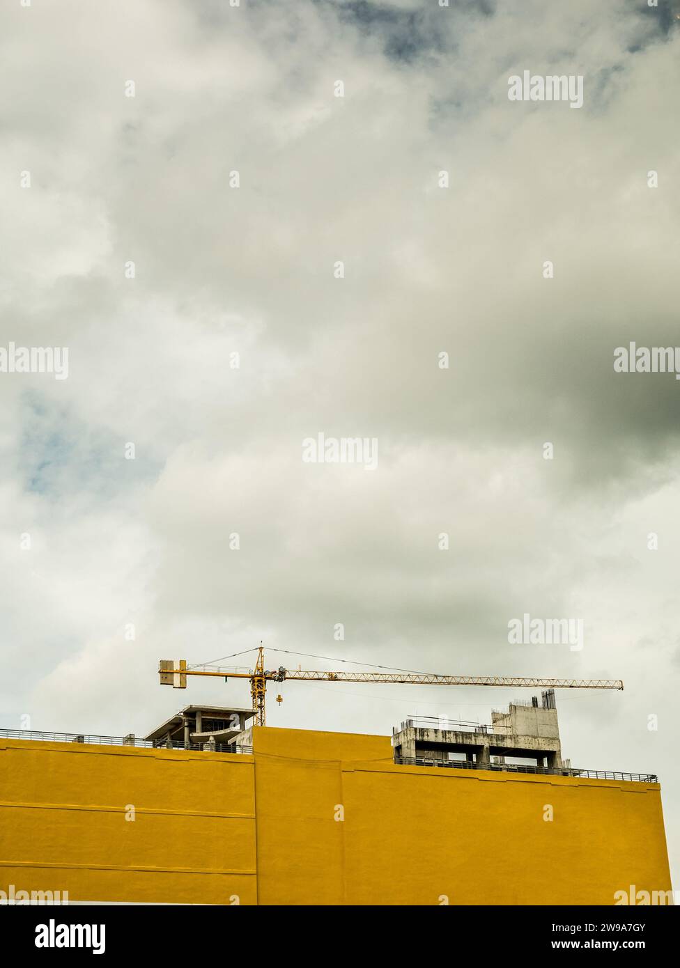 Construction tower crane at building site Stock Photo - Alamy