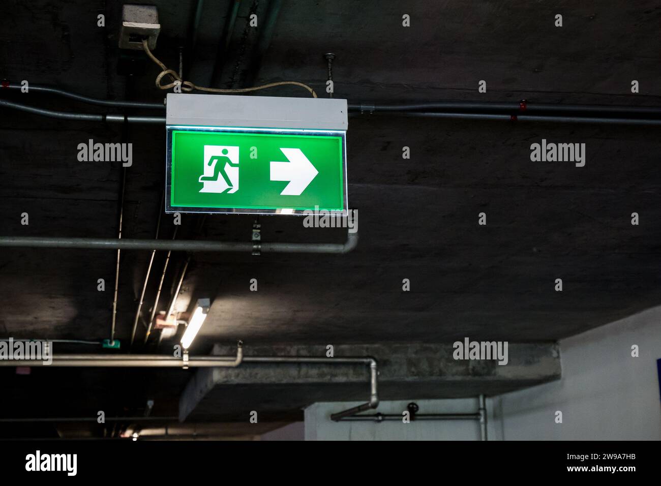 fire exit sign inside the building Stock Photo - Alamy