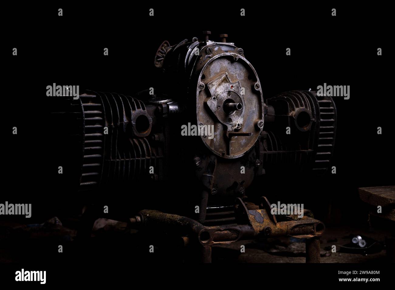 Old gasoline engine from a motorcycle on a black background Stock Photo ...