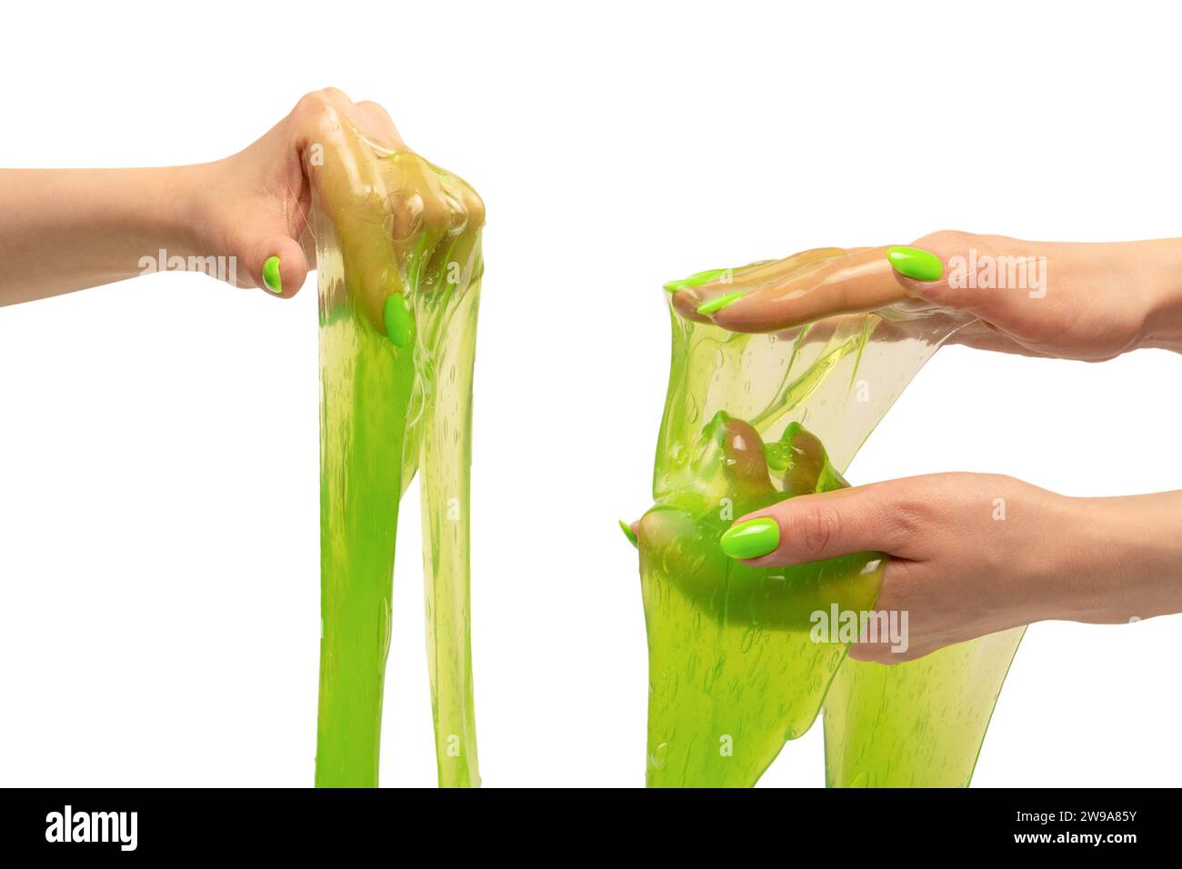 Green slime toy in woman hand with green nails isolated on a white ...