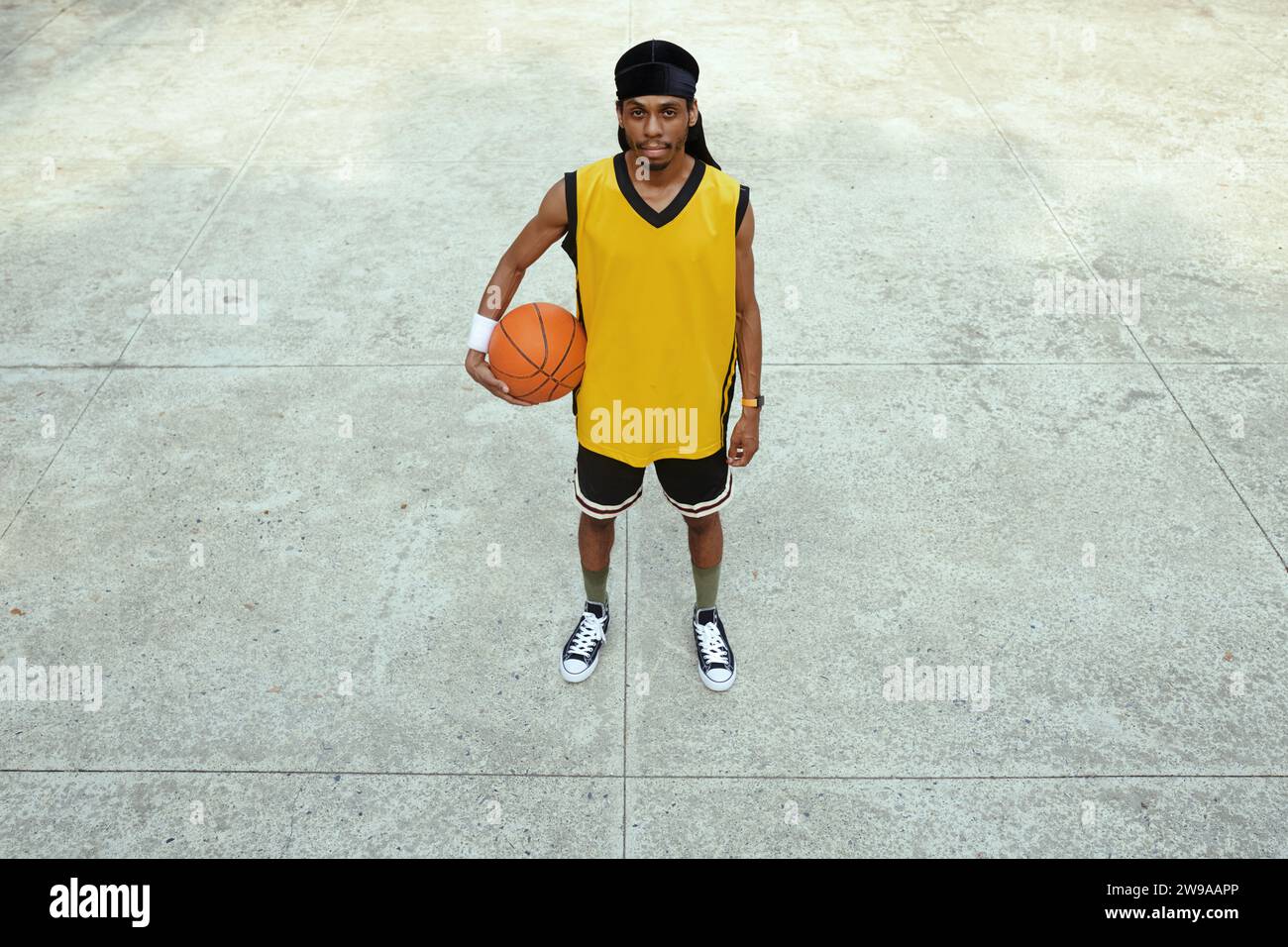 Portrait of determined Black streetball player wearing durag and ...
