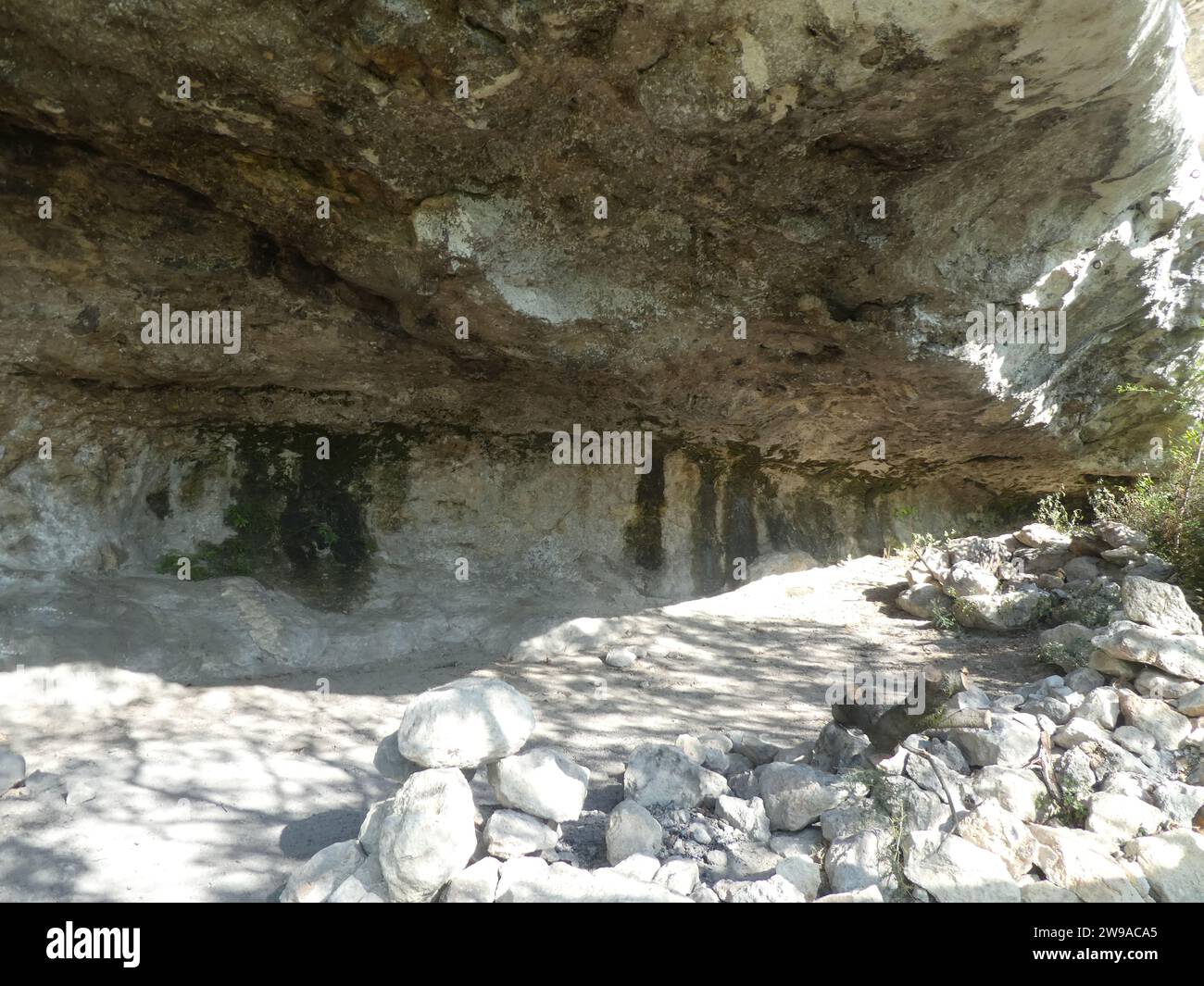 very ancient cave dug into the rock used in prehistory by primitive men ...