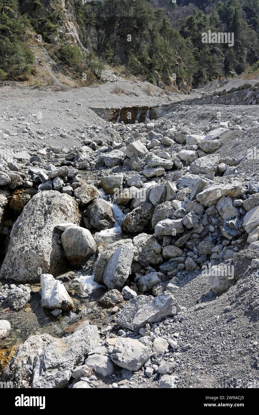 stone gully with little water due to the karst phenomenon that makes ...