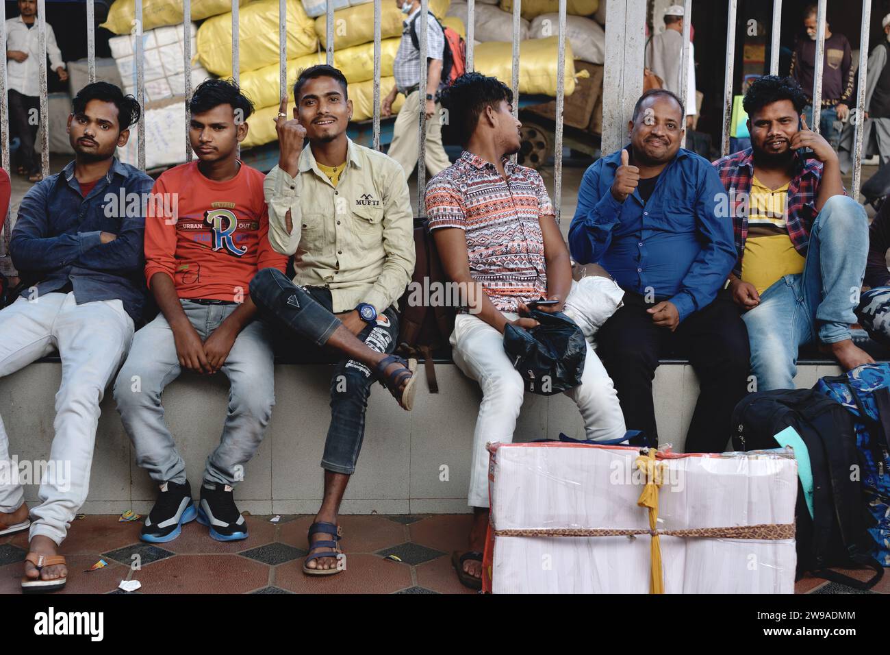 A group of mostly young North Indian men at Chhatrapati Shivaji Maharaj ...