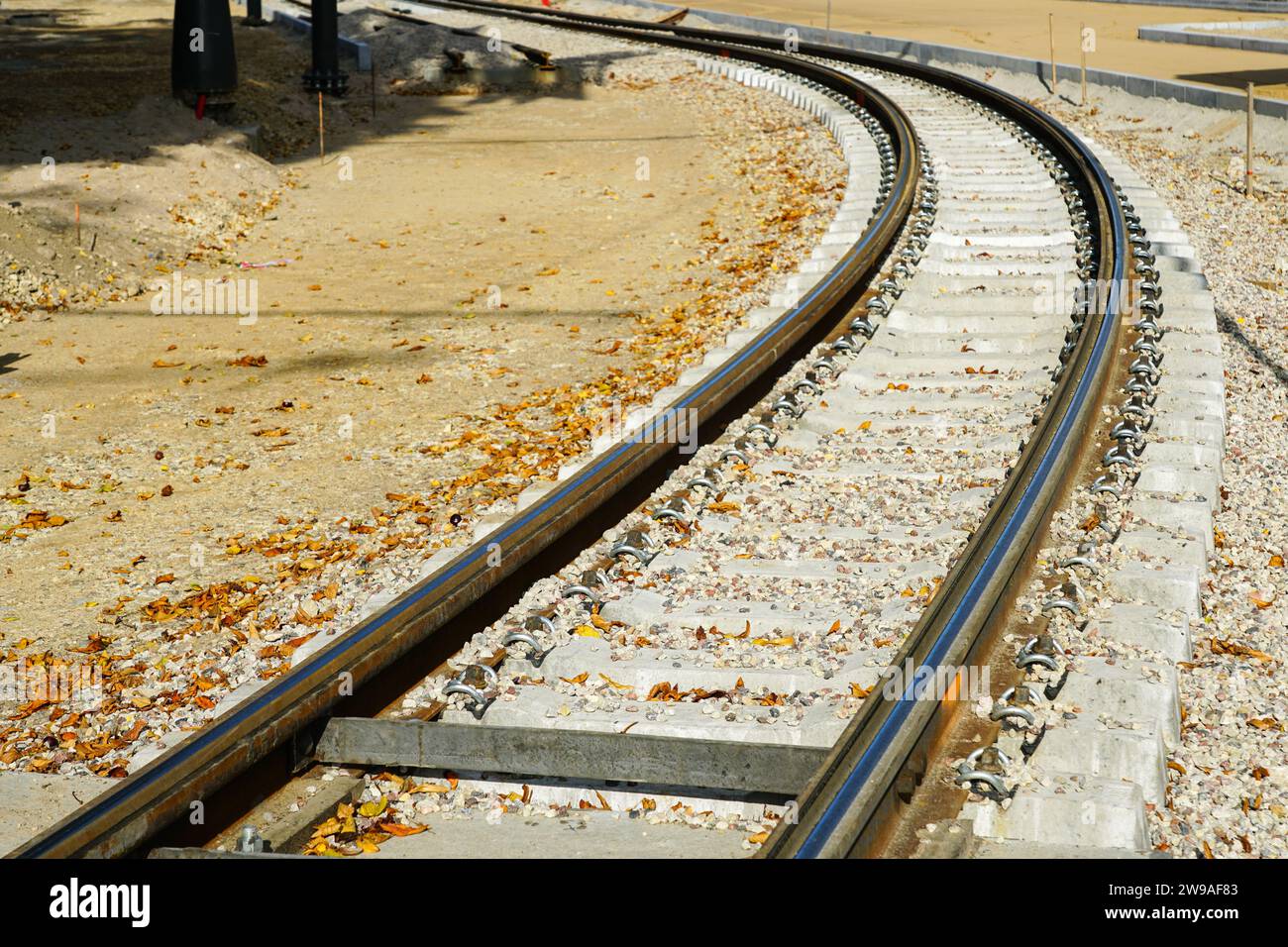 Construction of a new tram line, streetcar rail track laying on new ...