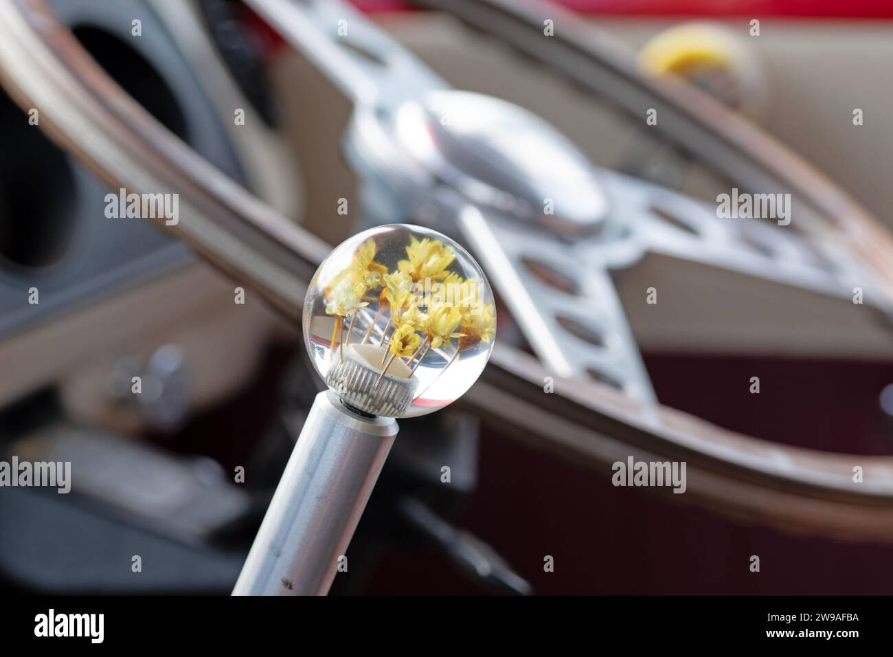 Vehicle gear lever glass ball and steering wheel. Abstract gear shifter ...