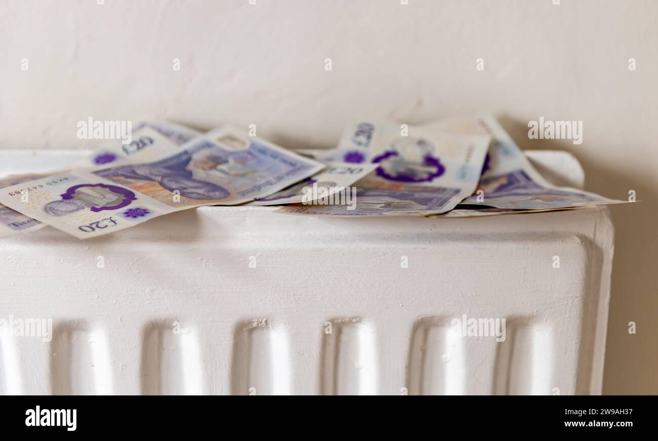 A loose pile of 20 pounds Sterling bank notes on top of a central ...