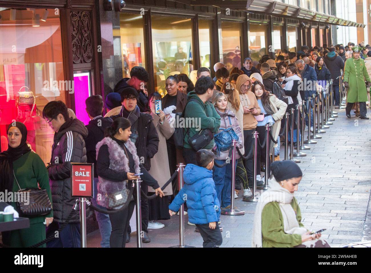 London, England, UK. 26th Dec, 2023. Customers are seen in queue ...