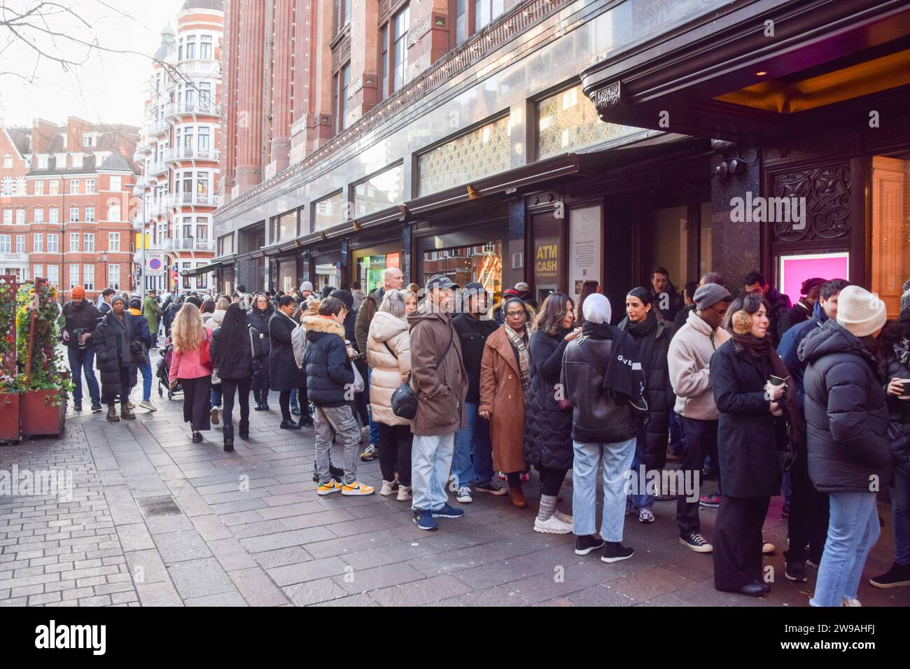 London, England, UK. 26th Dec, 2023. Customers queue outside Harrods in ...