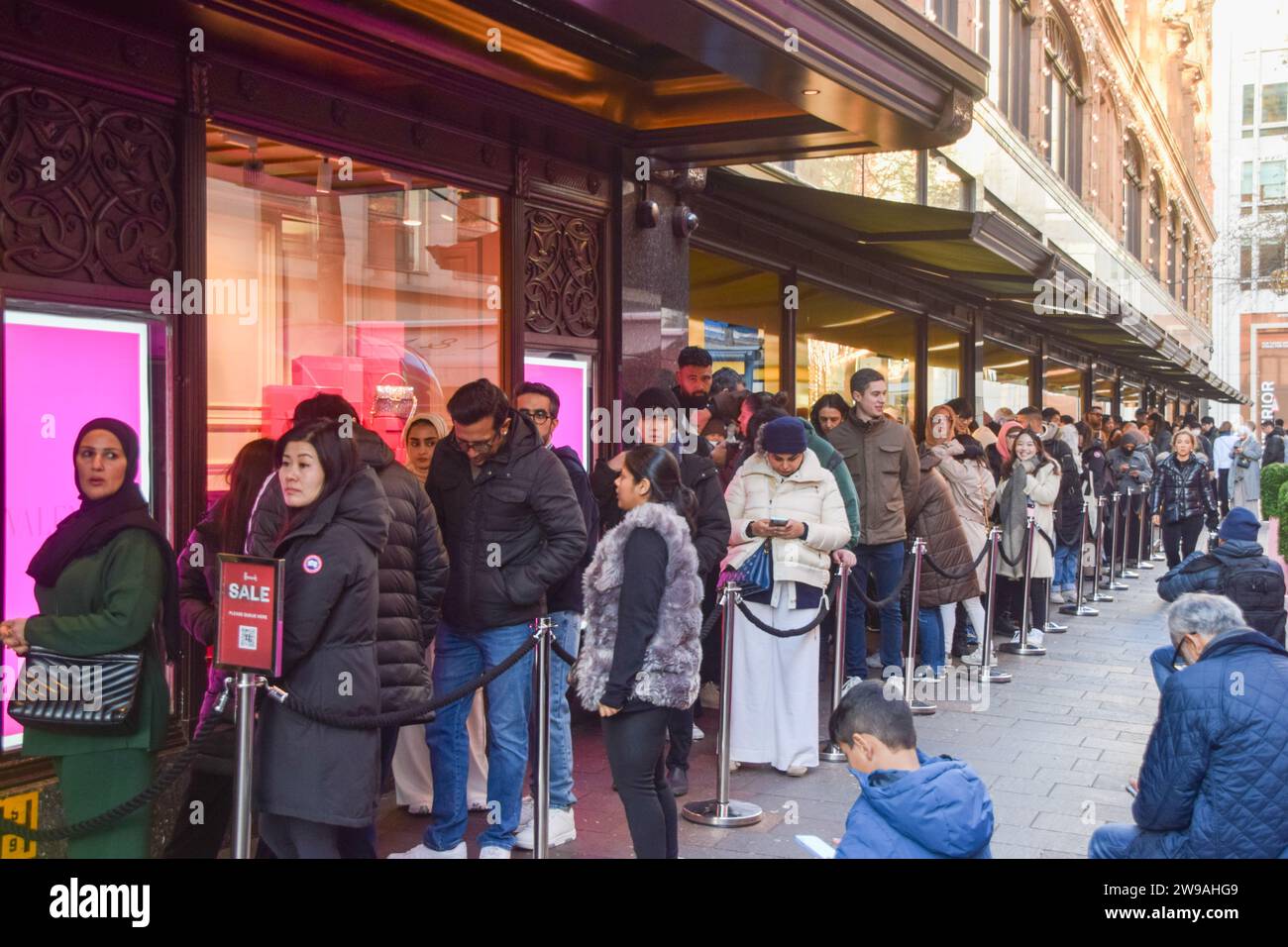 London, England, UK. 26th Dec, 2023. Customers queue outside Harrods in ...