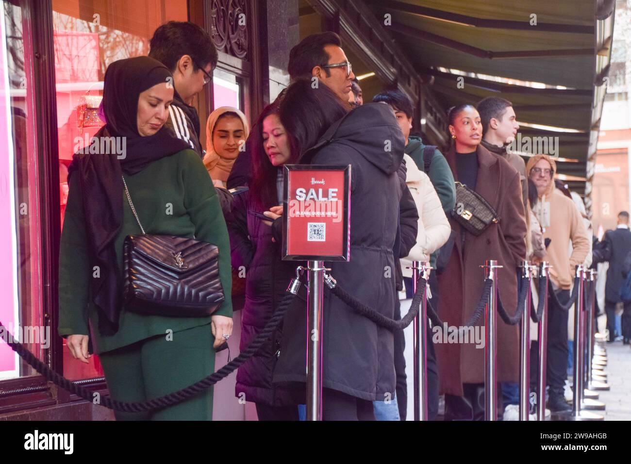 London, England, UK. 26th Dec, 2023. Customers queue outside Harrods in ...