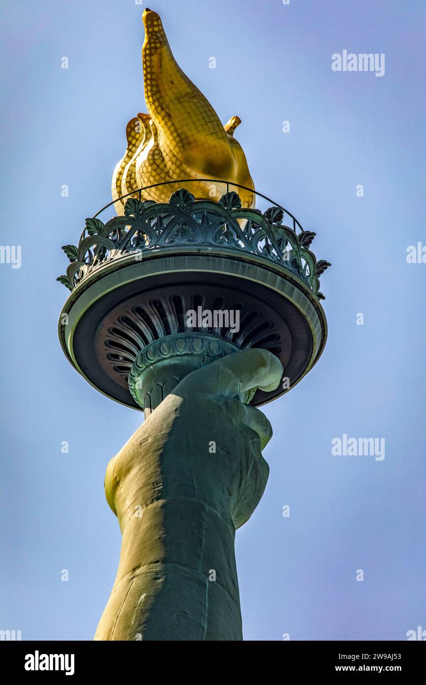 Photo of the Statue of Liberty hand holding her torch on a sunny day in ...