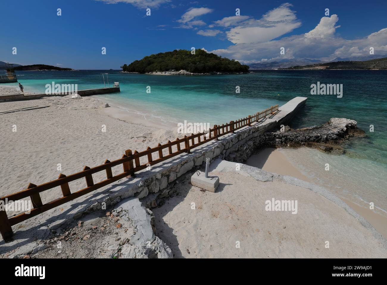 172 Bathing piers entering in the sand, Rilinda beach facing the bay ...