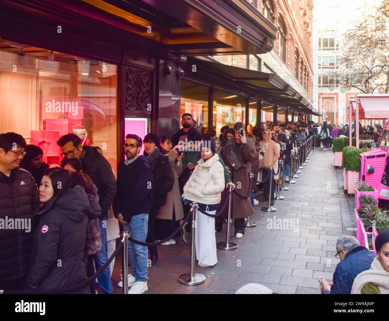London, England, UK. 26th Dec, 2023. Customers queue outside Harrods in ...