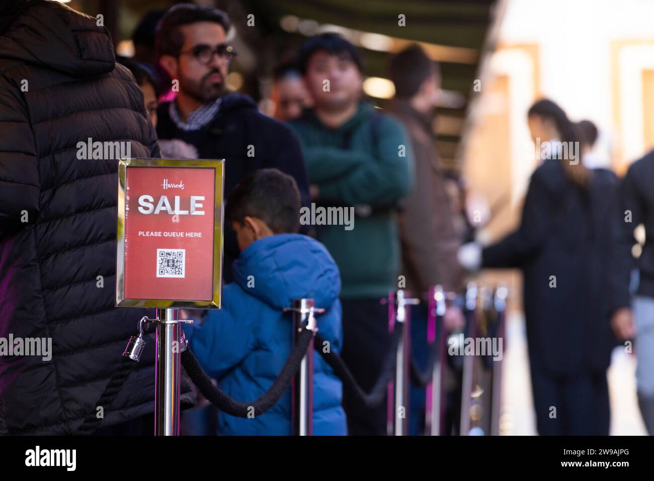 EDITORIAL USE ONLY Customers queue outside Harrods in Knightsbridge ...