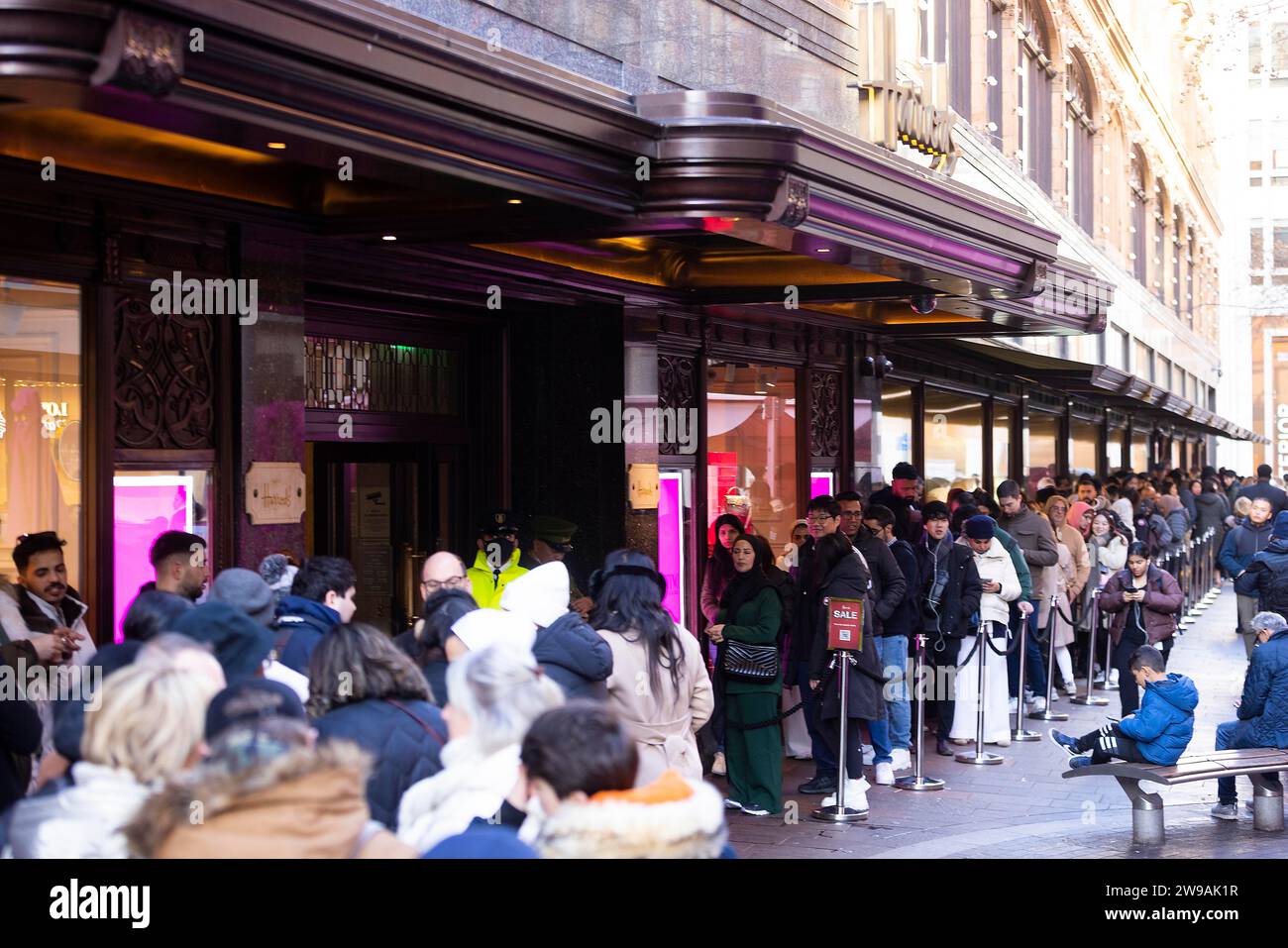 EDITORIAL USE ONLY Customers queue outside Harrods in Knightsbridge ...