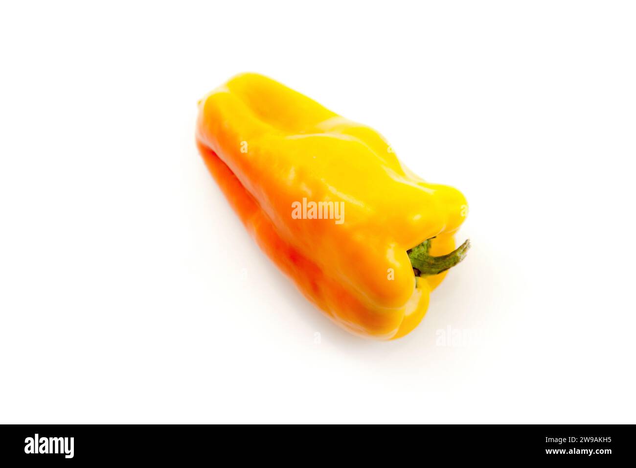 Whole yellow bell pepper (capsicum) known as sweet bell pepper, paprika ...