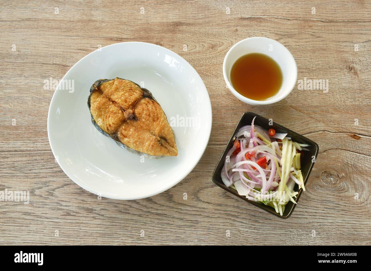 deep fried Indo-Pacific king mackerel fish dressing slice mango with ...