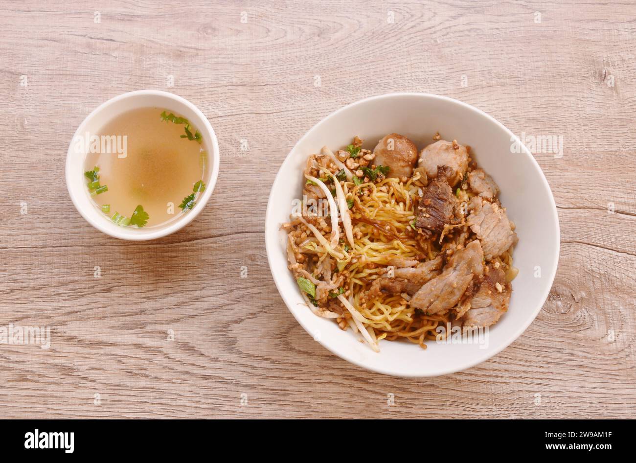 dry boiled Chinese yellow egg noodles with braised beef and meatball ...