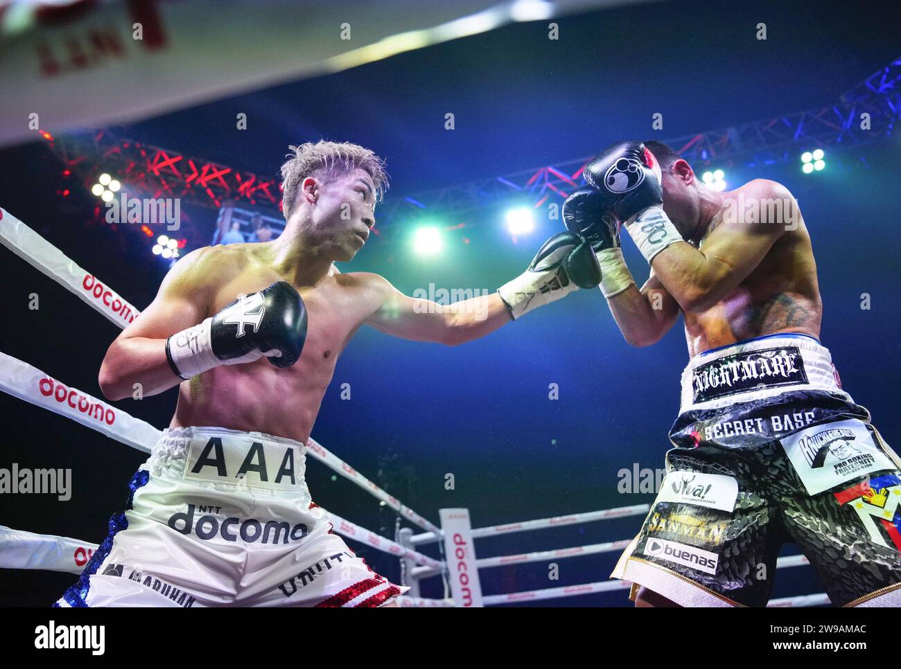 Japanese boxer Naoya Inoue (L) throws a punch at Marlon Tapales of the ...