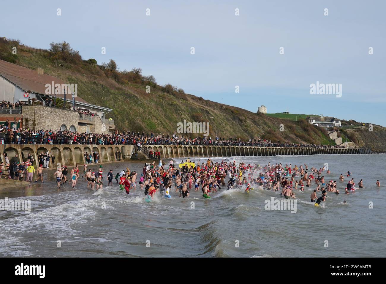 Swimmers take part in the Folkestone Lions' Boxing Day Dip at Sunny ...
