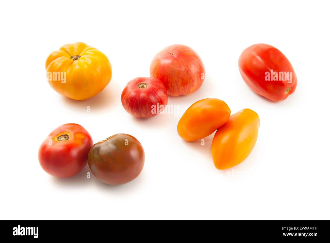 Assort of different shape and color whole ripe juicy tomatoes with soft ...