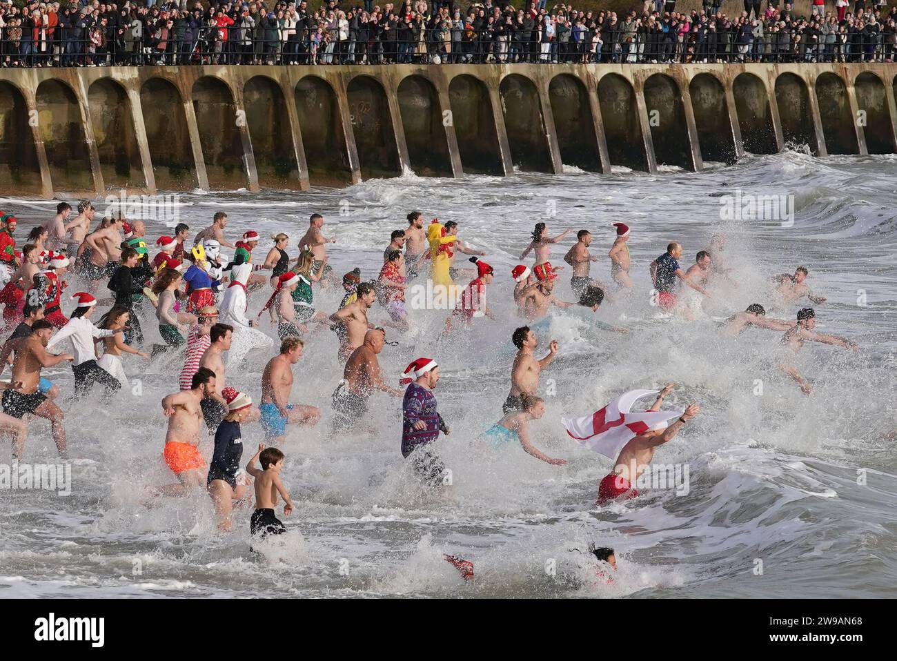 Swimmers take part in the Folkestone Lions' Boxing Day Dip at Sunny ...