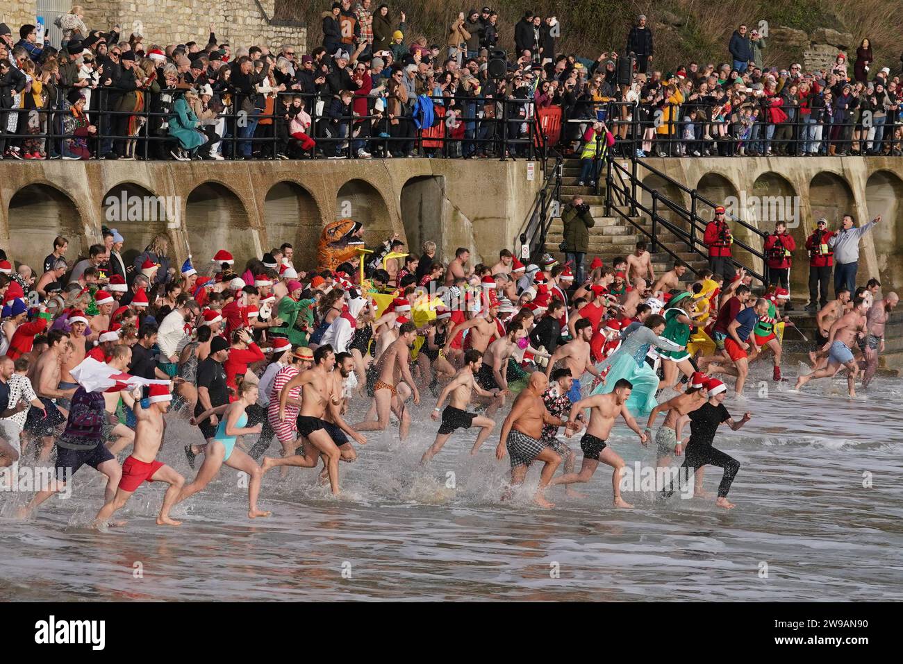 Swimmers take part in the Folkestone Lions' Boxing Day Dip at Sunny ...